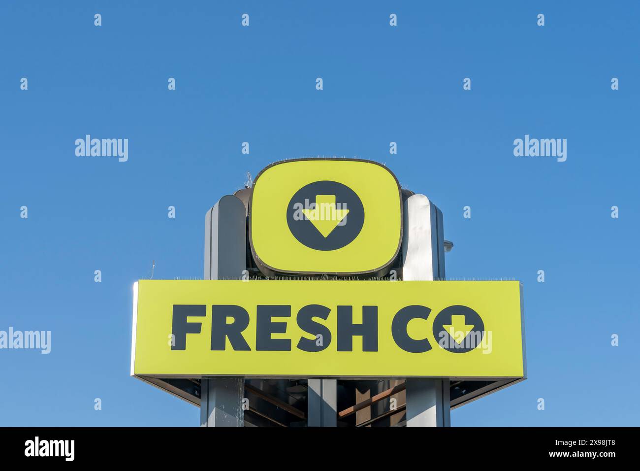 Closeup of FreshCo store sign with the blue sky background. Winnipeg ...