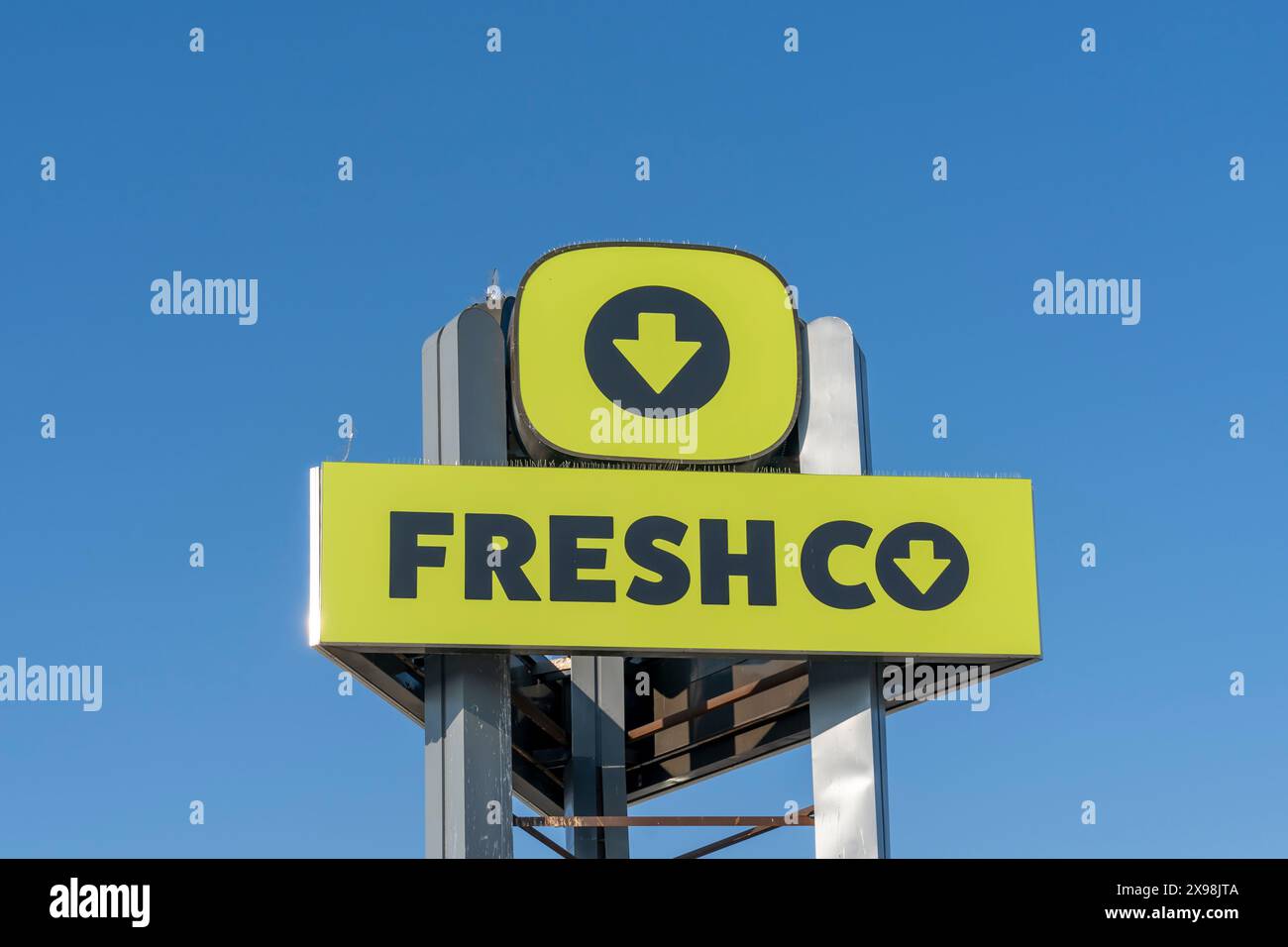 Closeup of FreshCo store sign with the blue sky background. Winnipeg ...