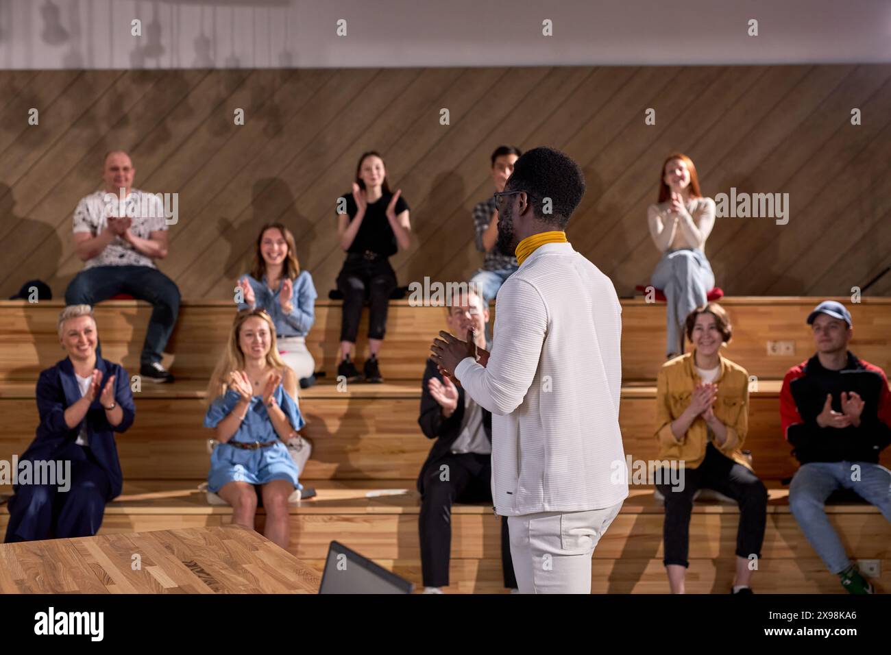 male african-american speaker giving presentation in lecture hall ...