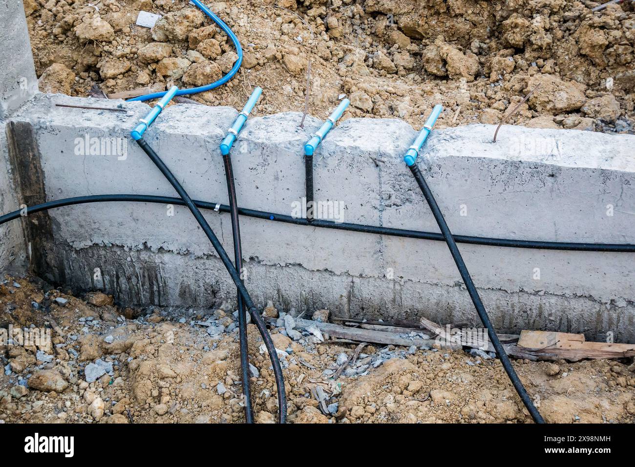 Pest control pipe system install at new house construction foundation ...