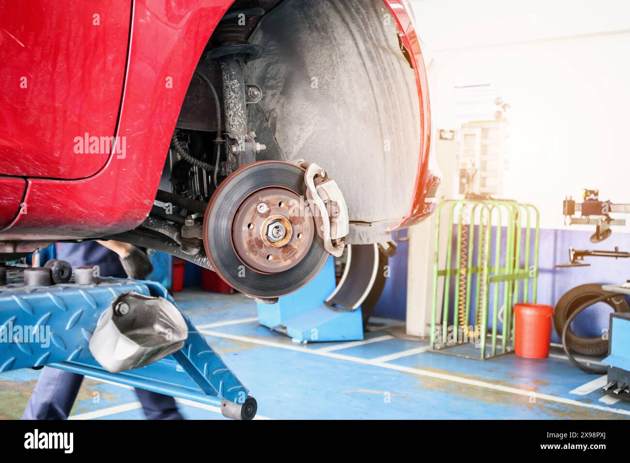 tyre replacement service, Car disc brake without wheels closeup at auto ...