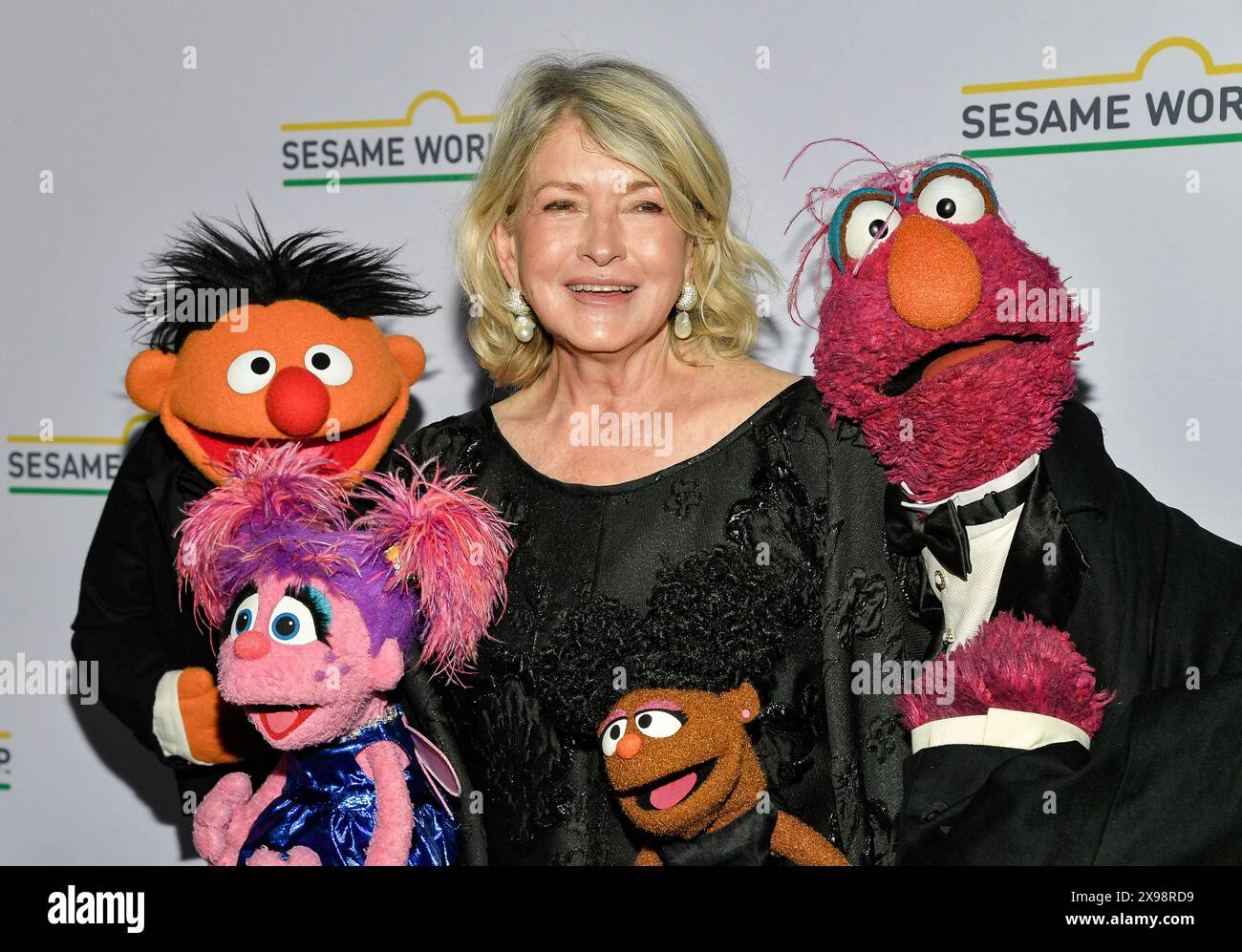 Martha Stewart, center, poses with Muppet characters at the Sesame ...