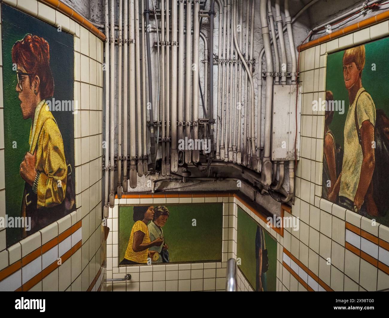 Art in the NJ PATH subway station is juxtaposed against these gray ...
