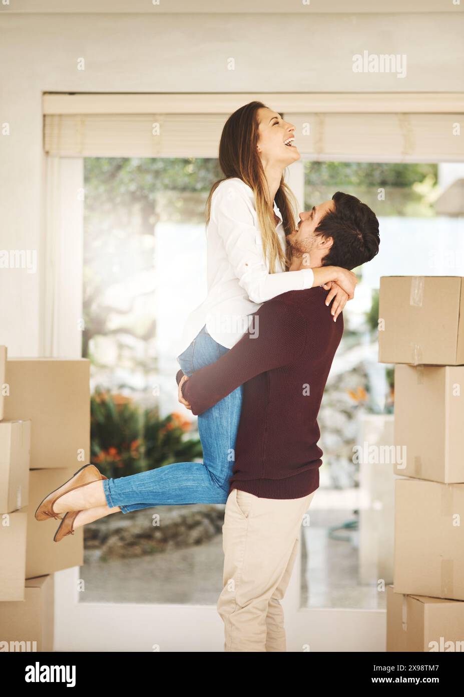 Excited, couple hug and boxes for moving to new home and celebration ...
