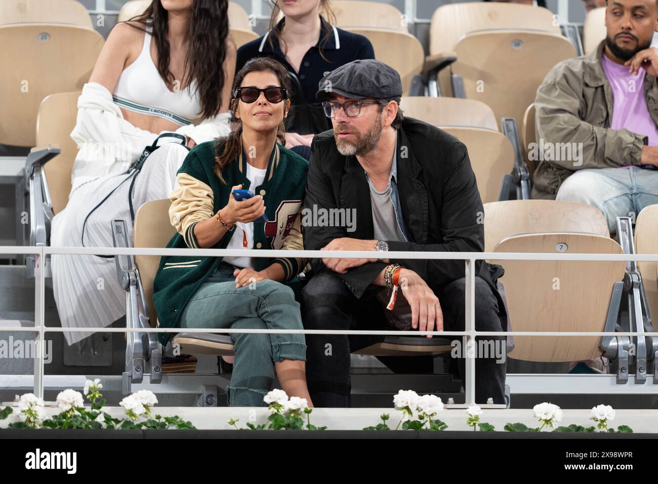 Paris, France. 29th May, 2024. Reem Kherici and her husband Gilles Lemaire in stands at the 2024 ...