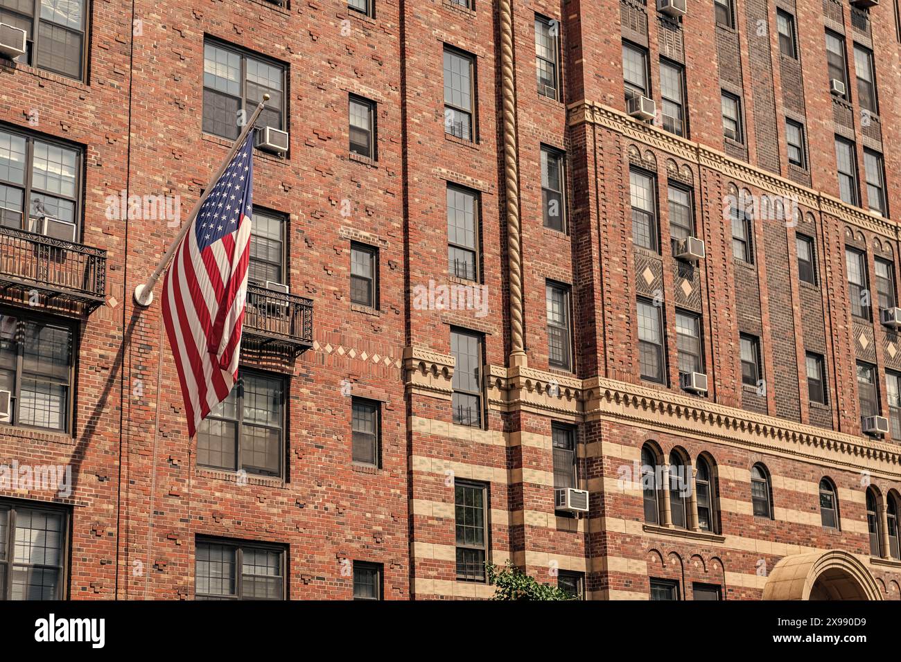 american flag on brick brownstone building. architectural exterior and ...