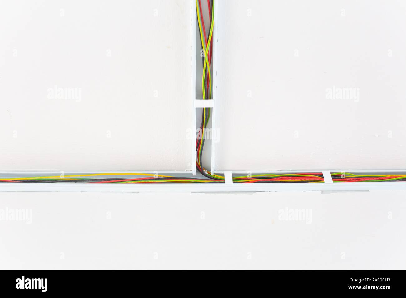 Exposed colourful cables on electrical wire casing base for rewiring ...