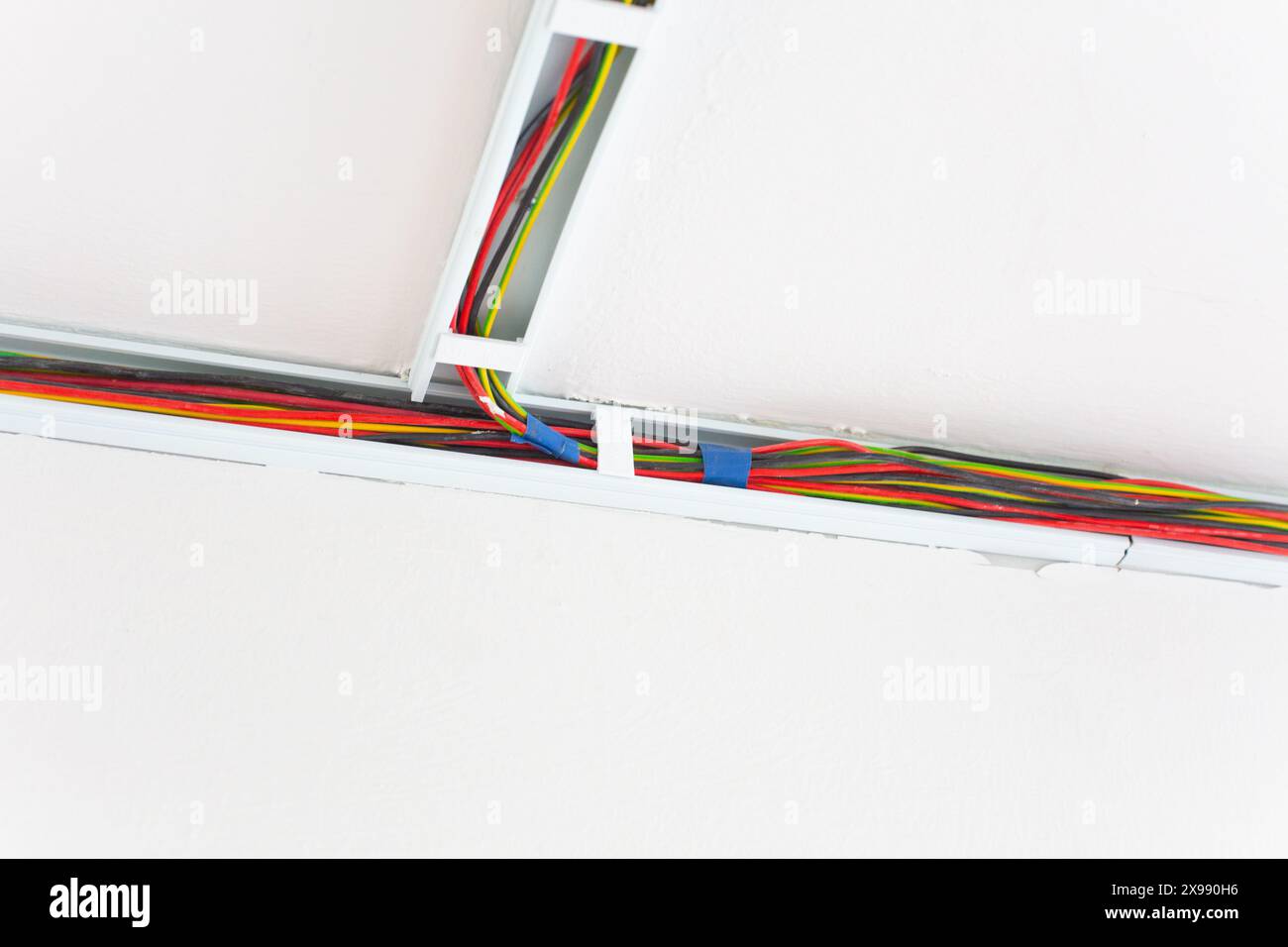 Exposed Colourful Cables On Electrical Wire Casing Base For Rewiring Purpose Is Layout Neatly On
