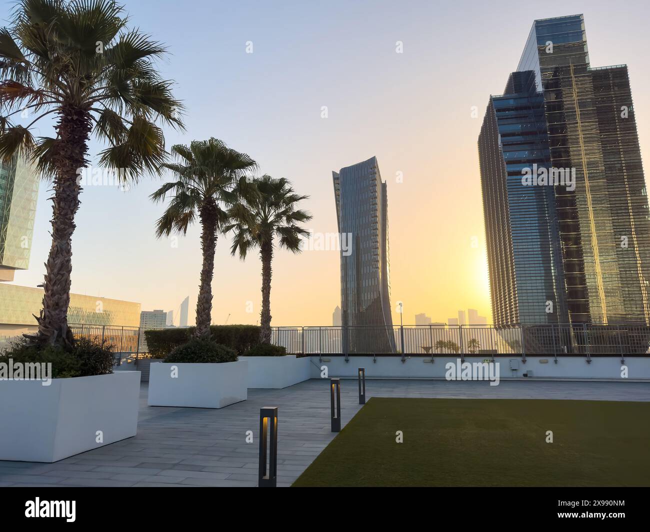 Palm trees and landscaped gardens in a park on Al Maryah Island ...