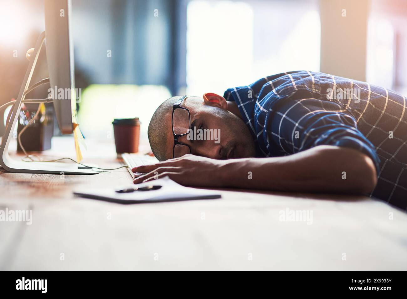 Business man, sleeping and tired by computer for fatigue, overworked or deadline in office ...