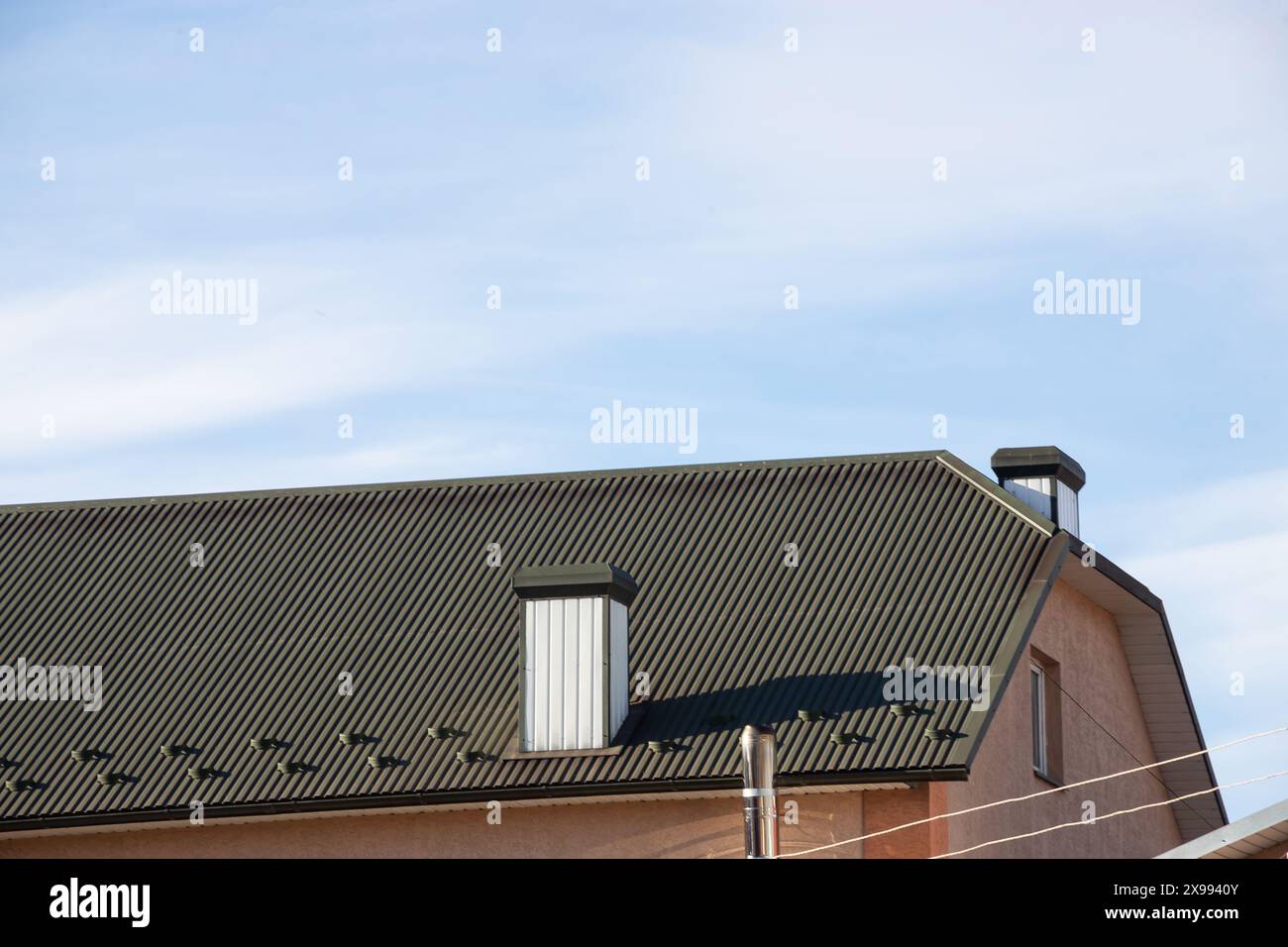 New roofing construction with attic skylights, rain gutter system, roof ...