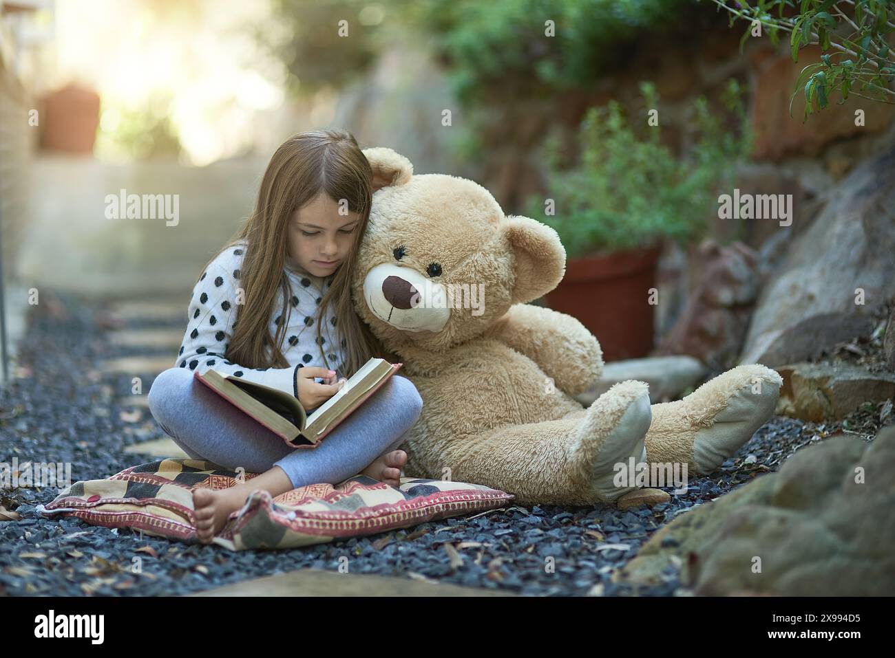 Outdoor, teddy bear and child with book for reading, education and ...
