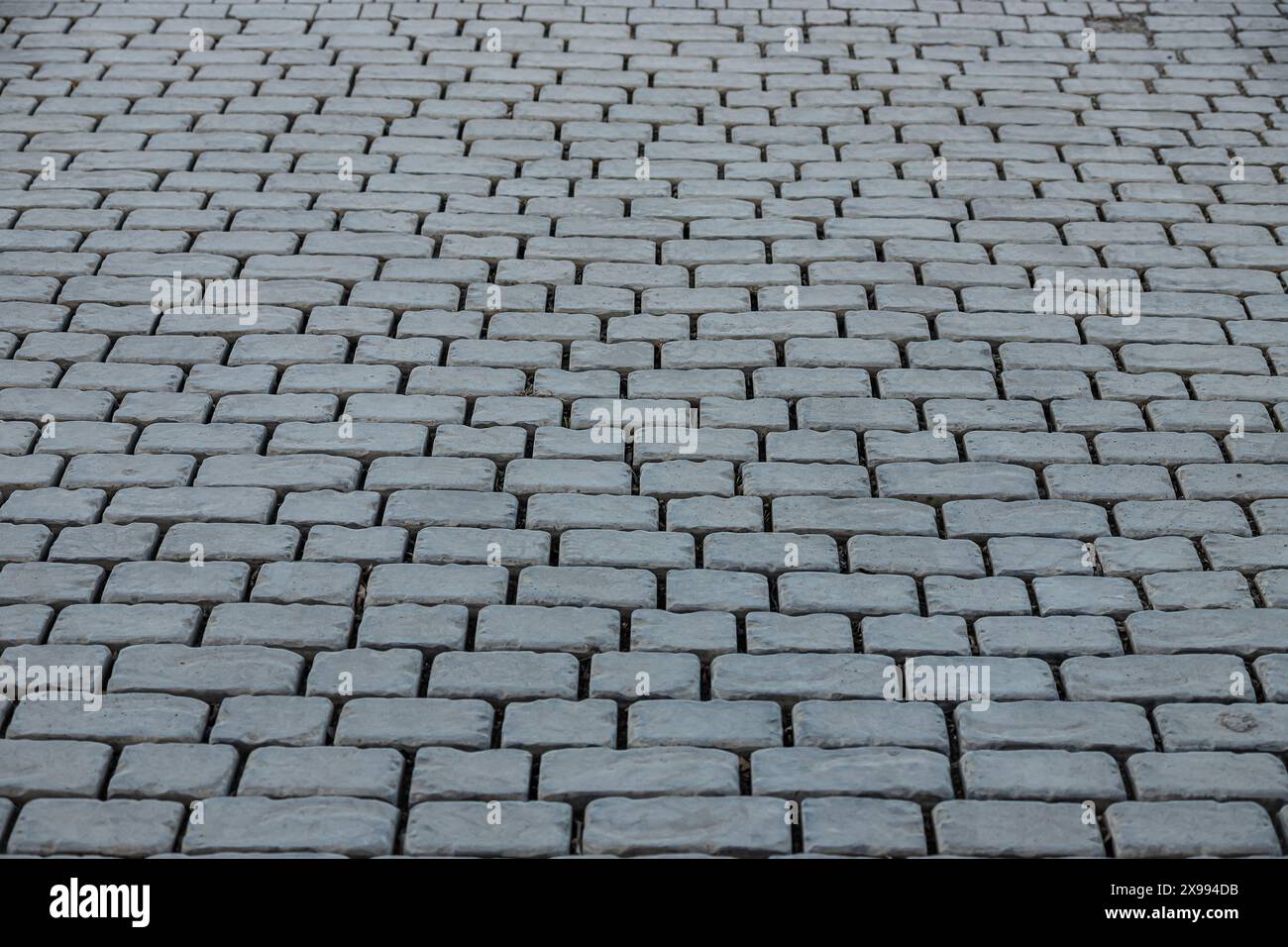 Cobble Stone Road In Lines Grey Background close-up Stock Photo - Alamy