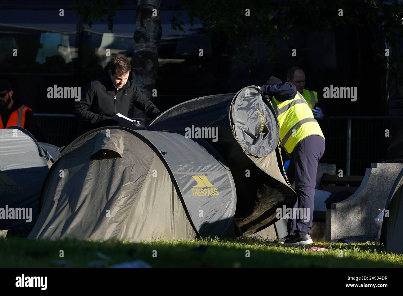 An early morning operation takes place to remove tents which have been ...