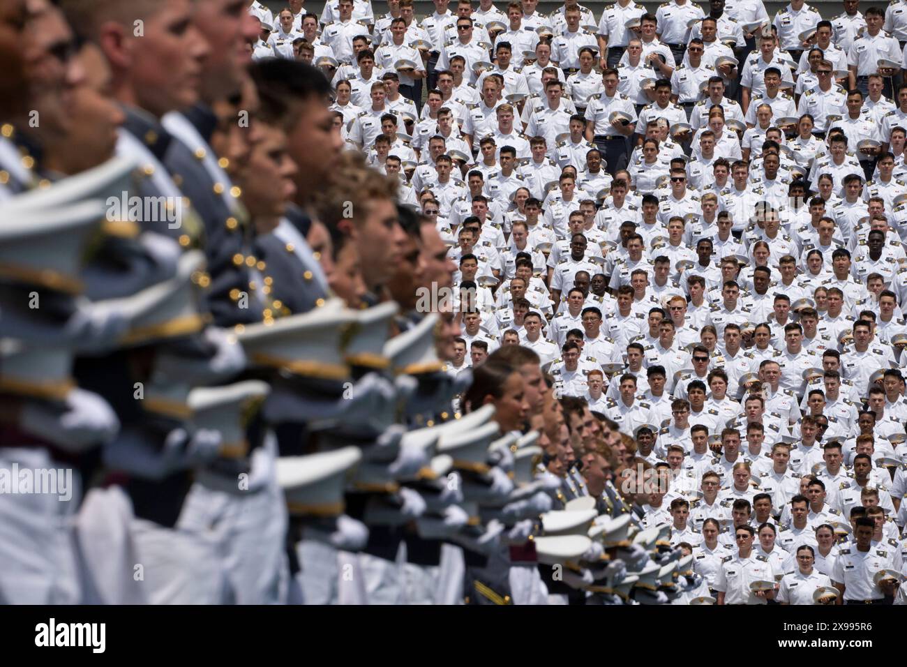 West Point, United States. 25 May, 2024. Commencing cadets, left, and ...