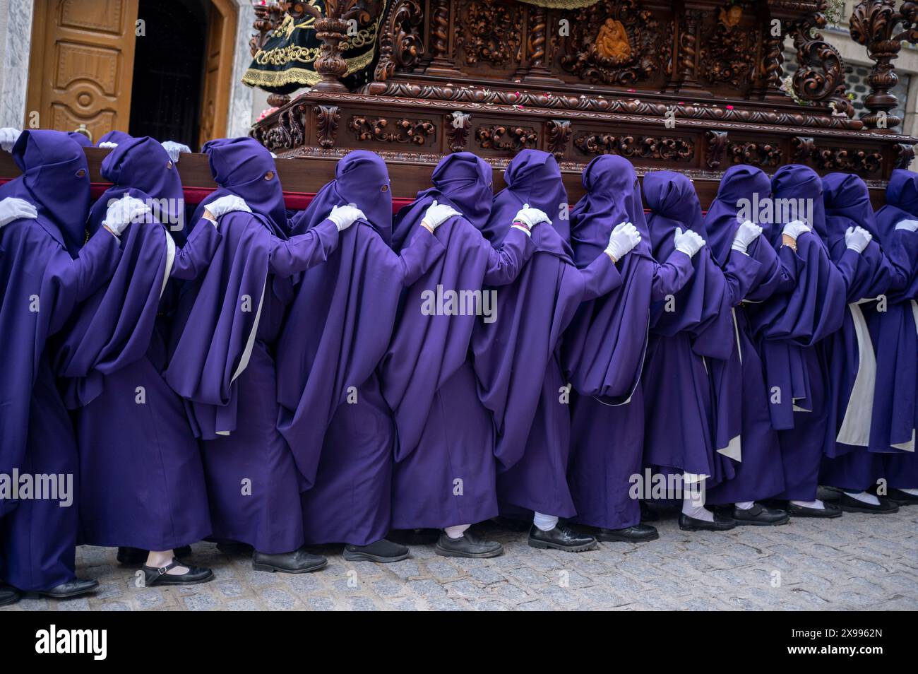 Devout Figures in Purple Robes: A Solemn Outdoor Ceremony by an Ornate ...