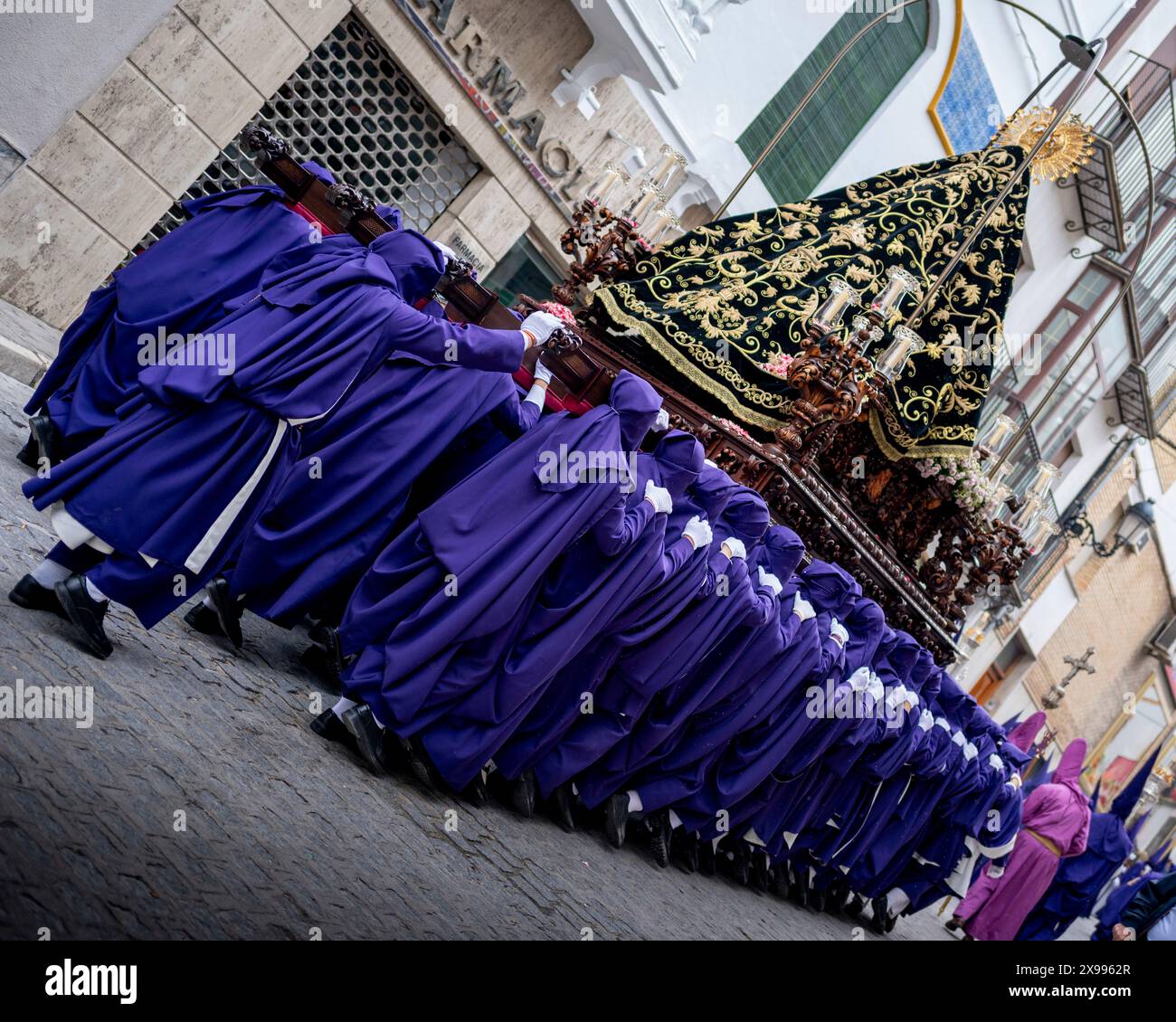 The Majestic March of Devout Carriers with an Ornate Religious Float ...