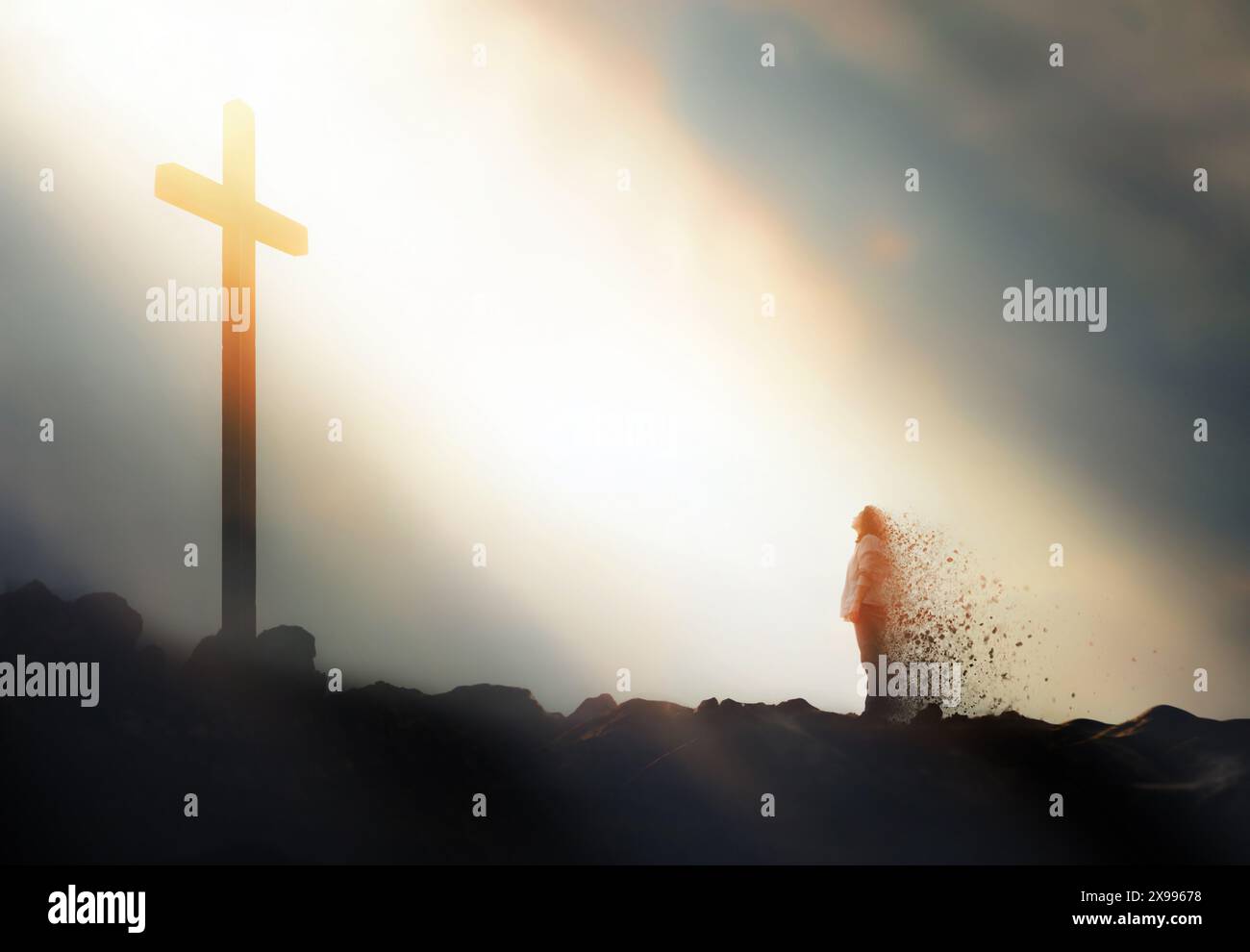 Christian standing in front of the cross of Jesus Christ with bright ...