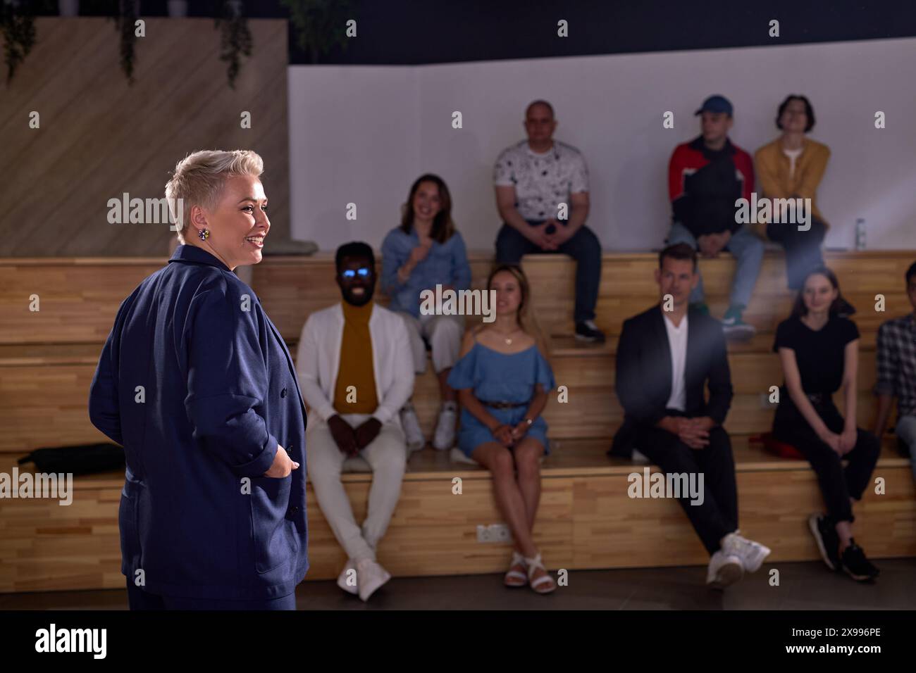 Female Lecturer In Formal Wear Smiling, Holding Conference Lecture To ...