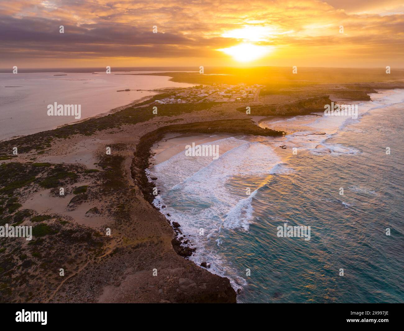 Aerial view of sunrise over rugged coastline surrounding Venus Bay on ...