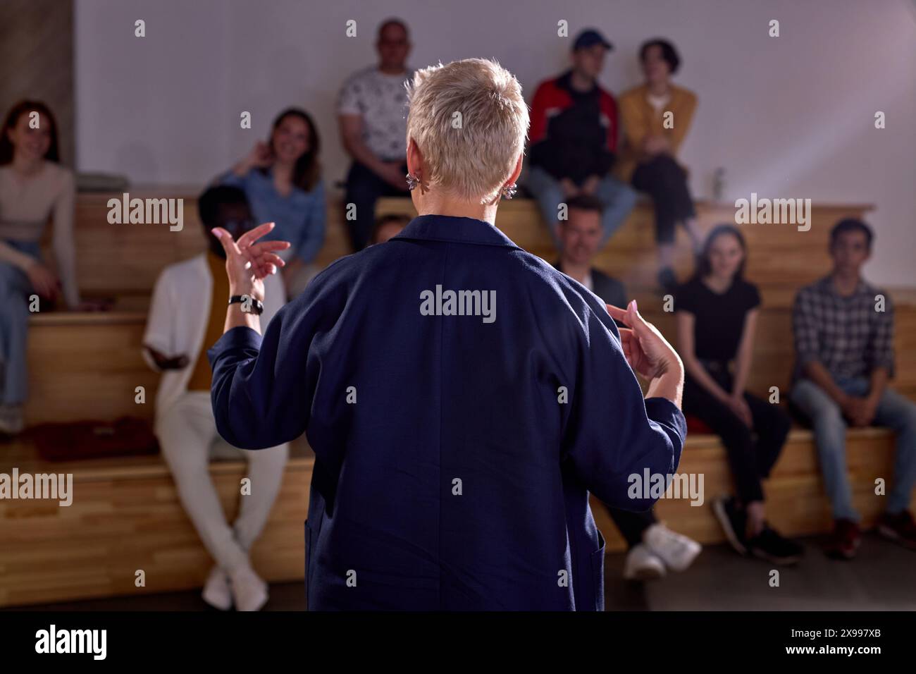 Rear View On Confident Female Speaker Holding Conference Lecture For ...