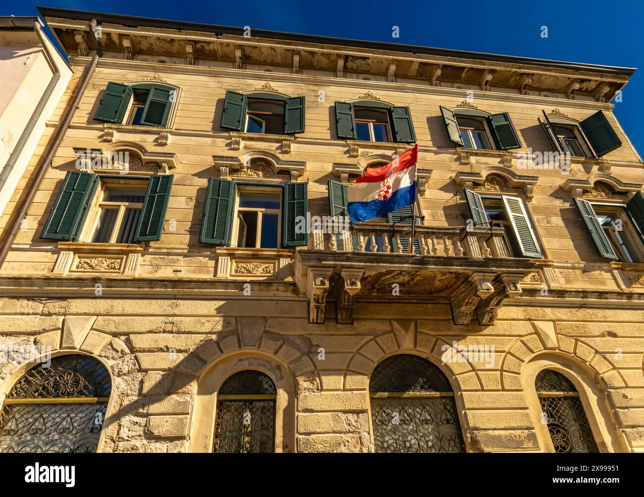 The historic office building in Rovinj with the national flag of ...