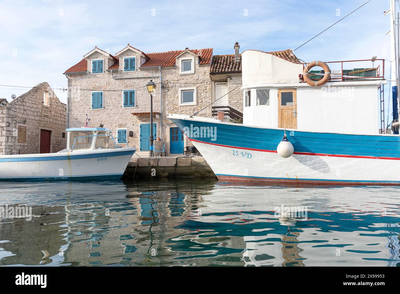 Traditional fishing wooden boats in a small port in a small beautiful ...