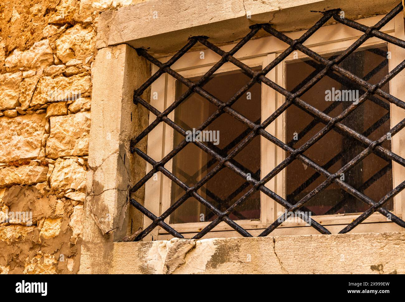 Windows in an old medieval prison building Stock Photo - Alamy