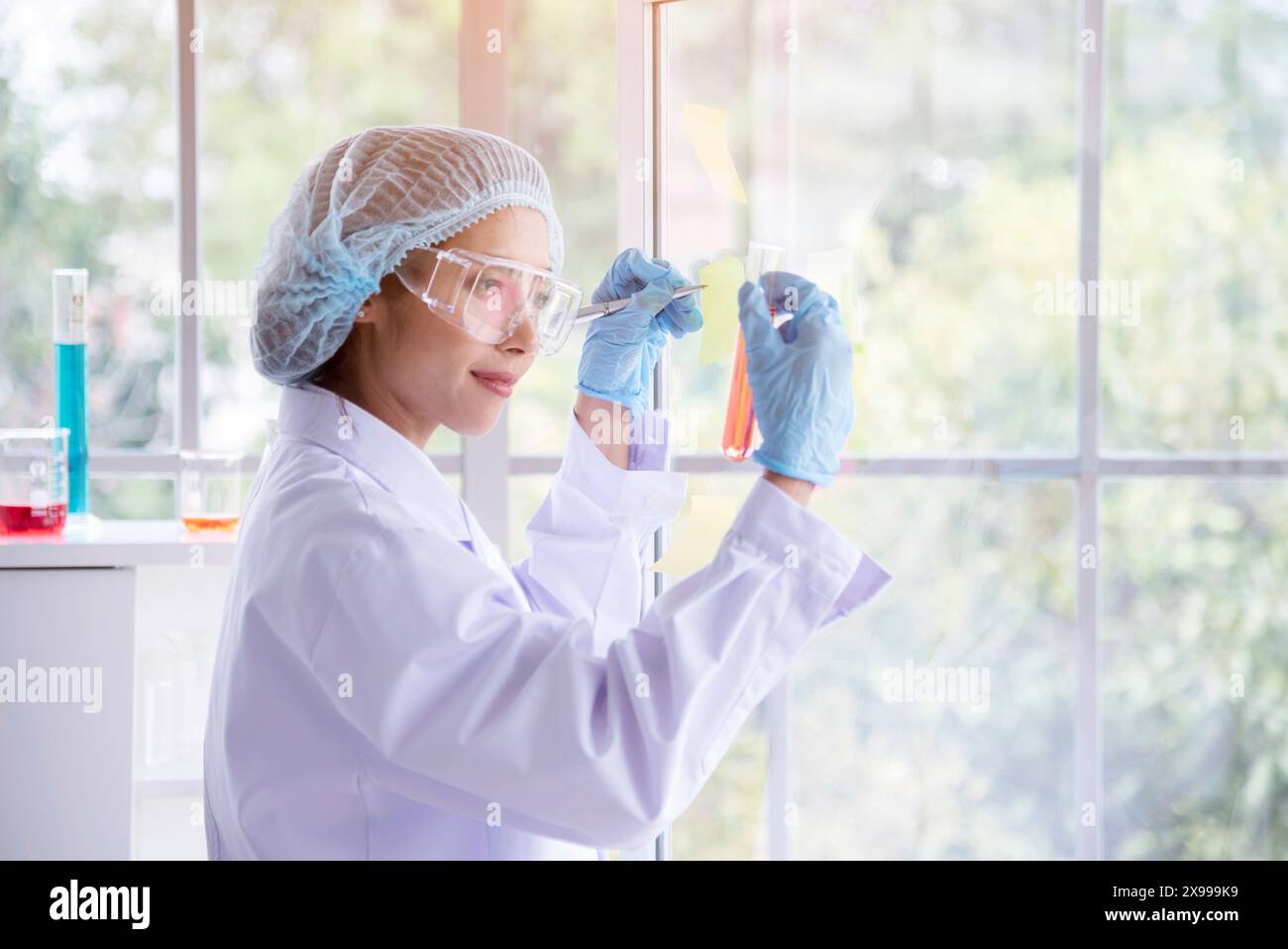 Female scientist look at microscope, science test tube analyse ...