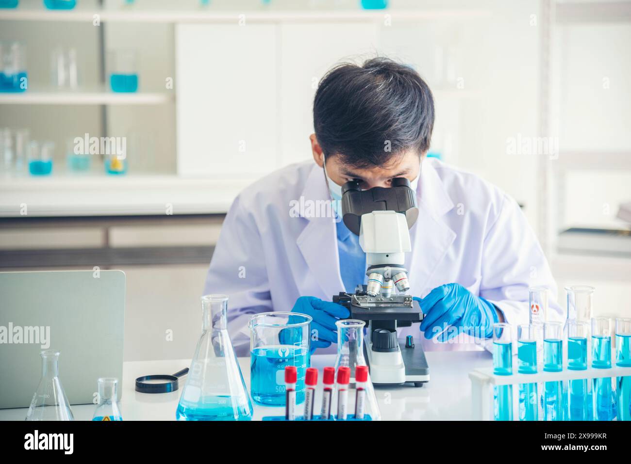 Scientist covid-19 virus antibody sample in laboratory research ...