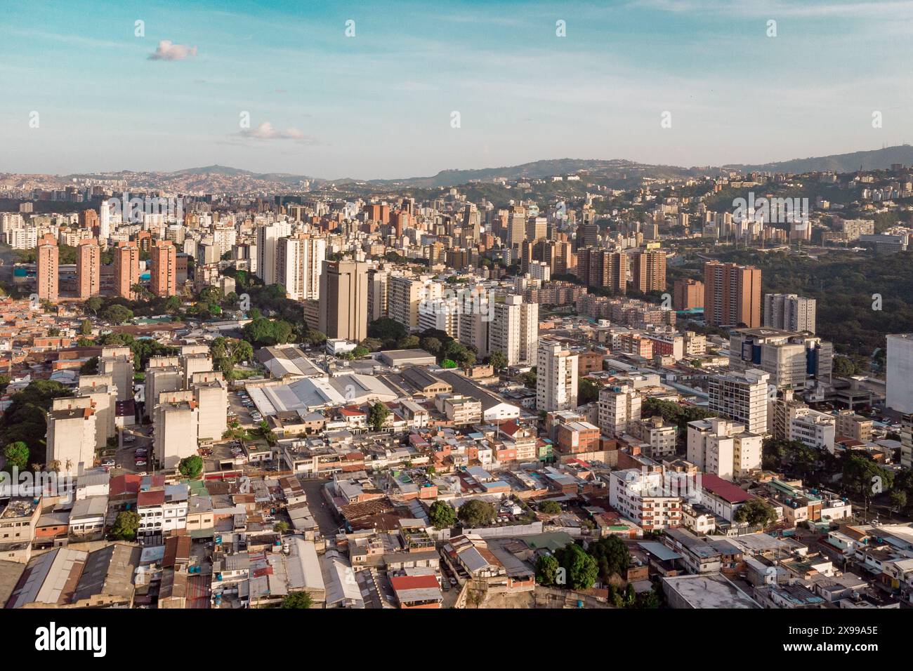 Aerial view of Caracas at sunset with the David Tower landmark ...