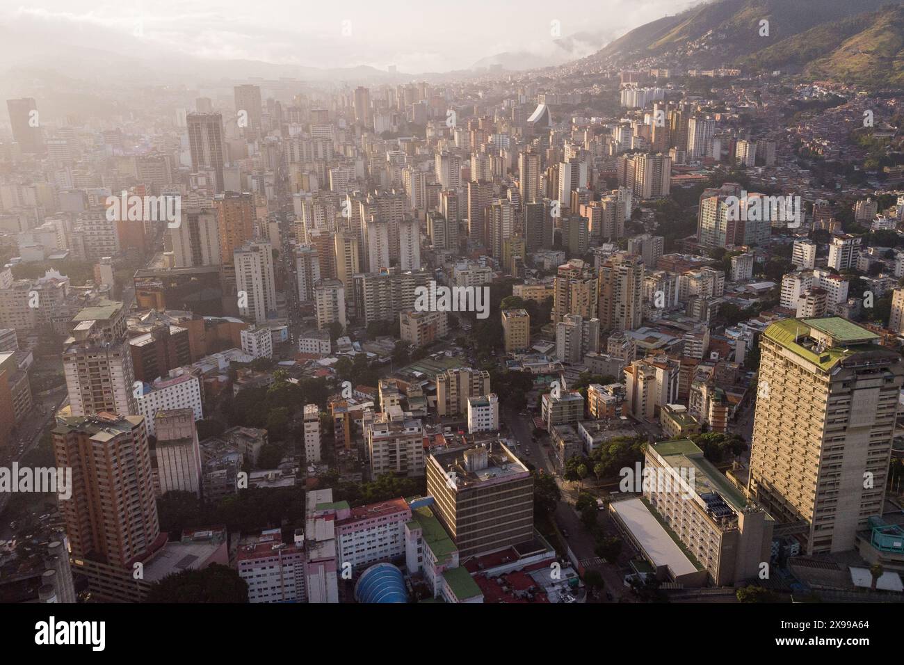 Aerial view of Caracas at sunset with the David Tower landmark ...