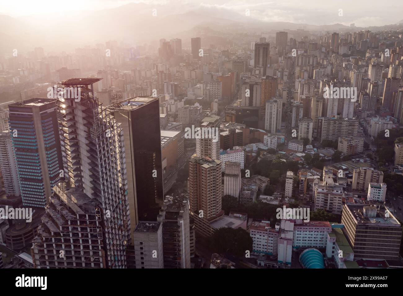 Aerial view of Caracas at sunset with the David Tower landmark ...