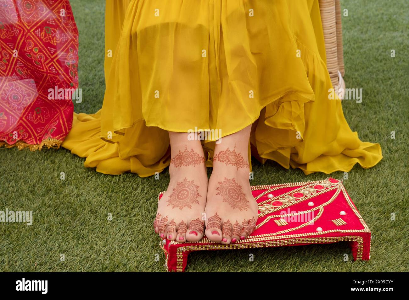Beautifully decorated woman's feet with intricate henna symbols and ...