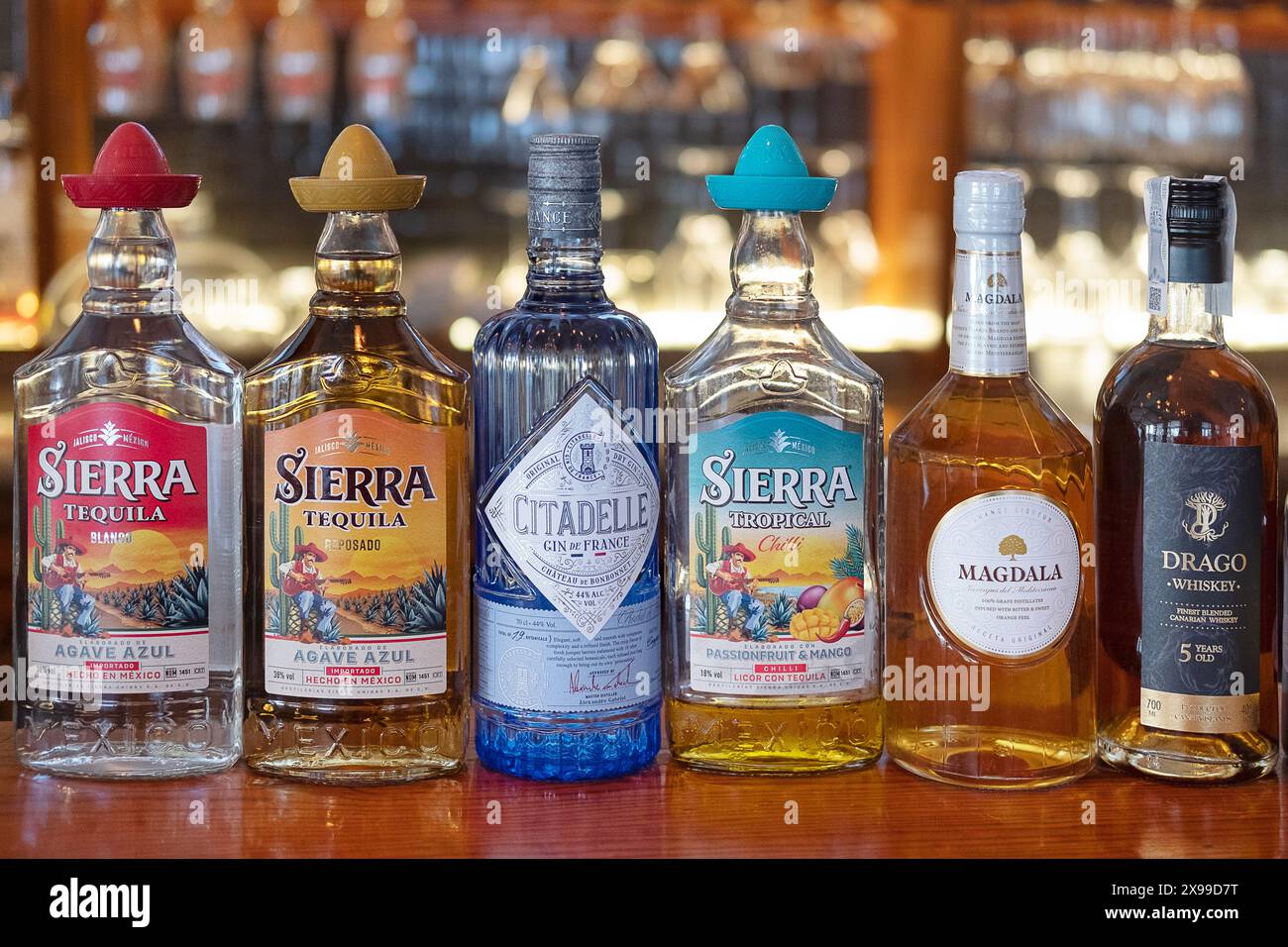 Display of premium spirits on bar counter such as Sierra Tequila ...