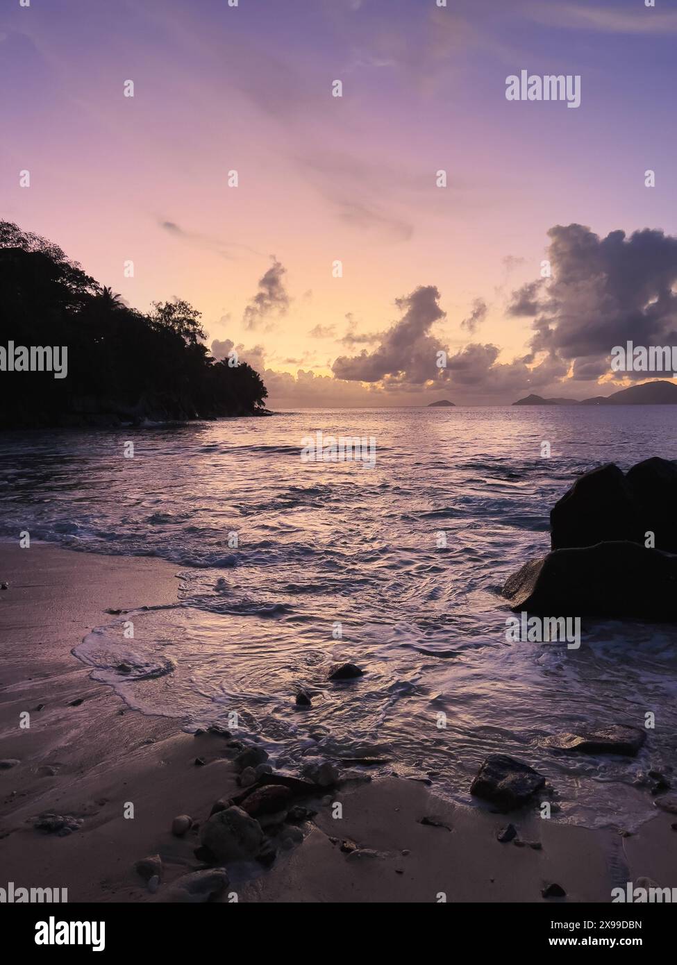 Sunset beach scene, Seychelles Stock Photo - Alamy