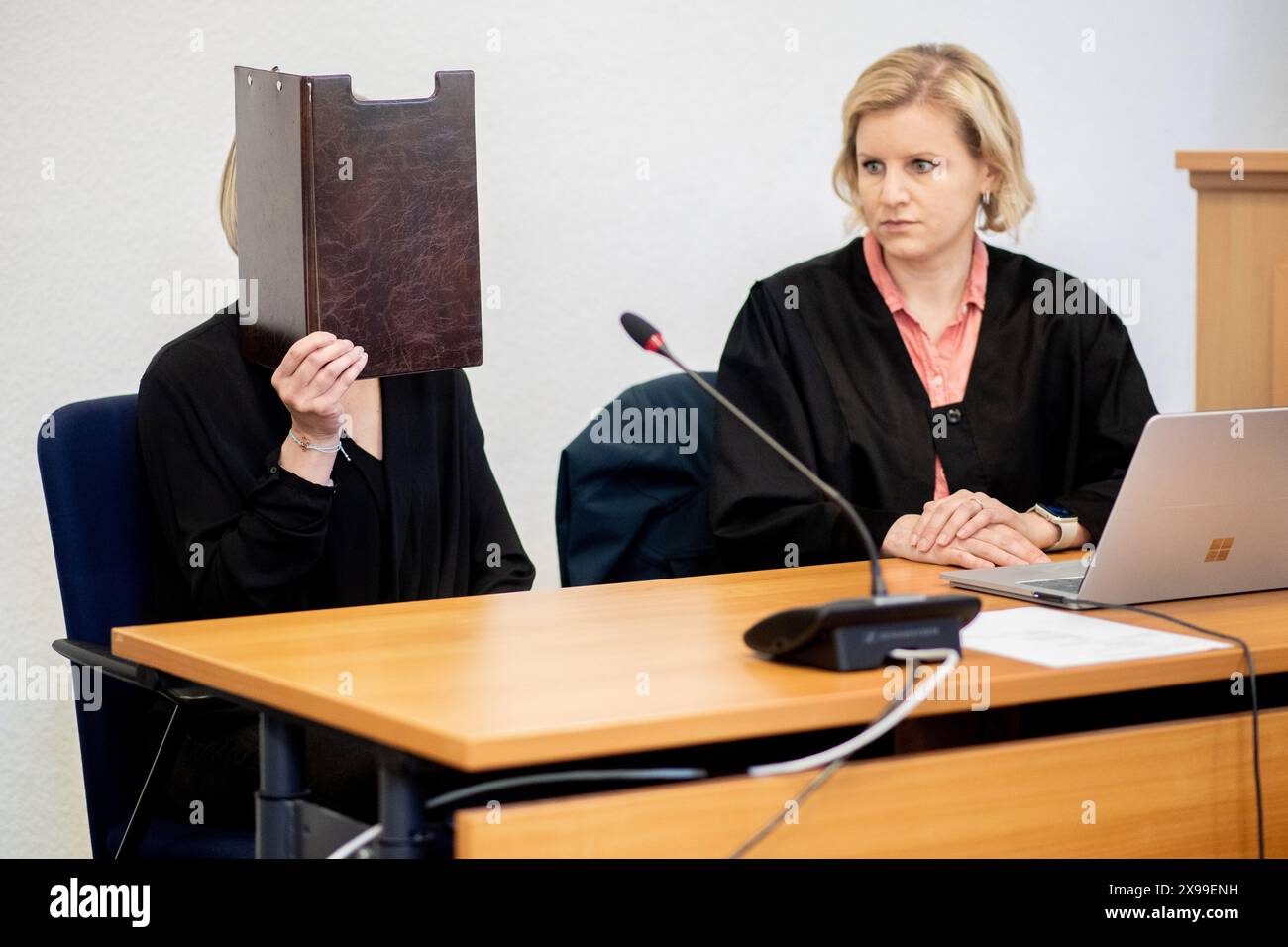 Oldenburg, Germany. 30th May, 2024. The defendant sits next to her ...