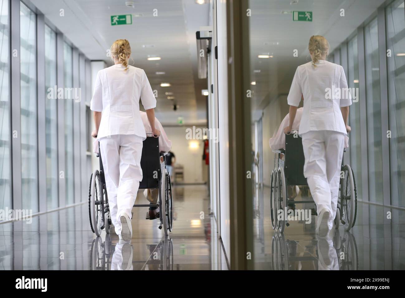 Nurse with patient in wheelchair, Corridor, Onkologikoa Hospital ...