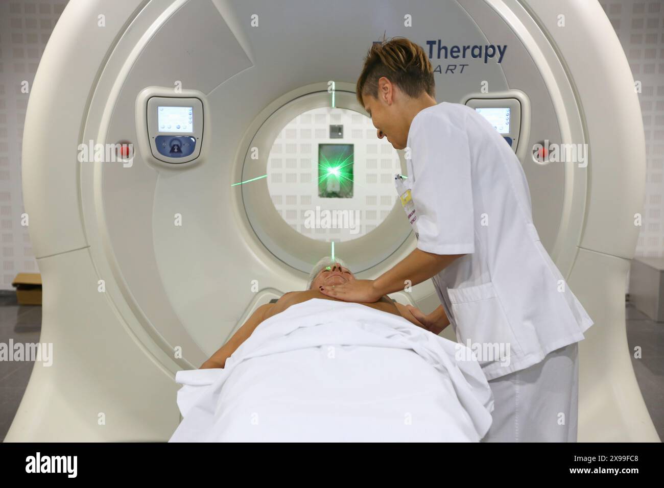 TomoTherapy, Hi-Art, Type of radiation therapy in which the radiation ...