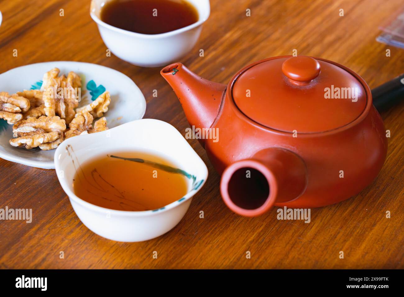 Very Old Chinese TeaPot with Tea Pouring in a small bowls Tea Tasting ...