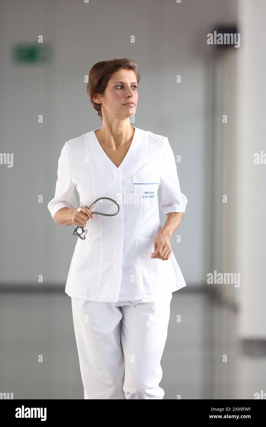 Nurse walking in corridor, Onkologikoa Hospital, Oncology Institute ...