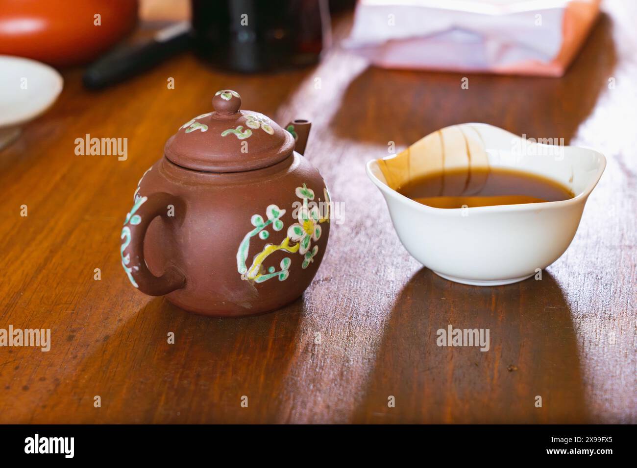 Very Old Chinese TeaPot with Tea Pouring in a small bowls Tea Tasting ...