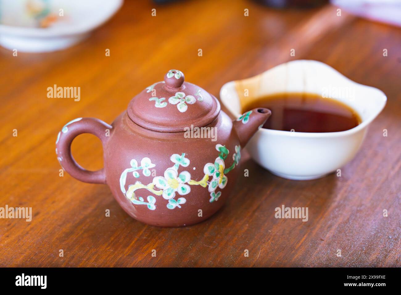 Very Old Chinese TeaPot with Tea Pouring in a small bowls Tea Tasting ...