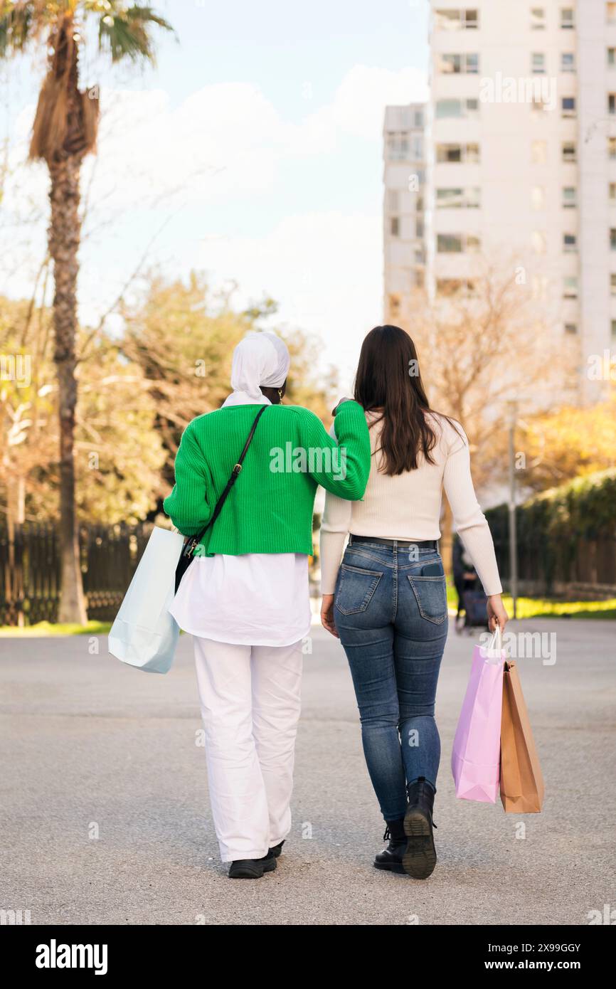 Two women walking on park hi-res stock photography and images - Alamy