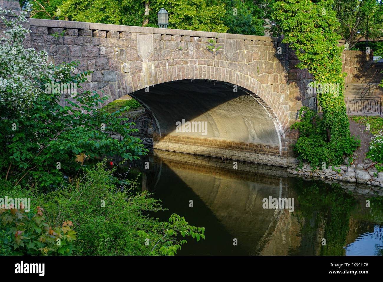 A beautiful stone bridge over a canal Stock Photo - Alamy