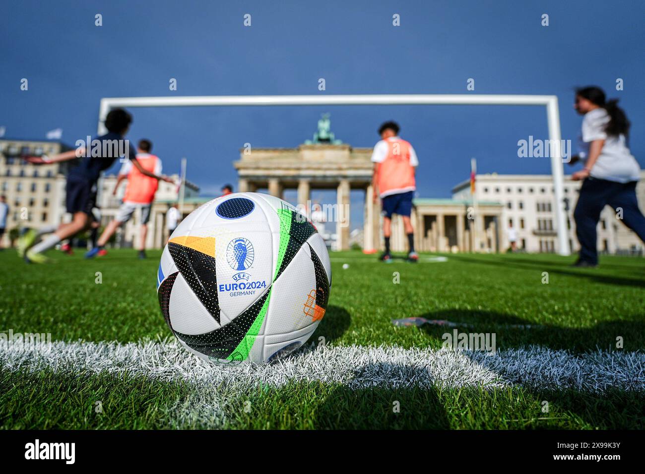 Berlin, Germany. 26th May, 2024. Children play soccer on the artificial ...