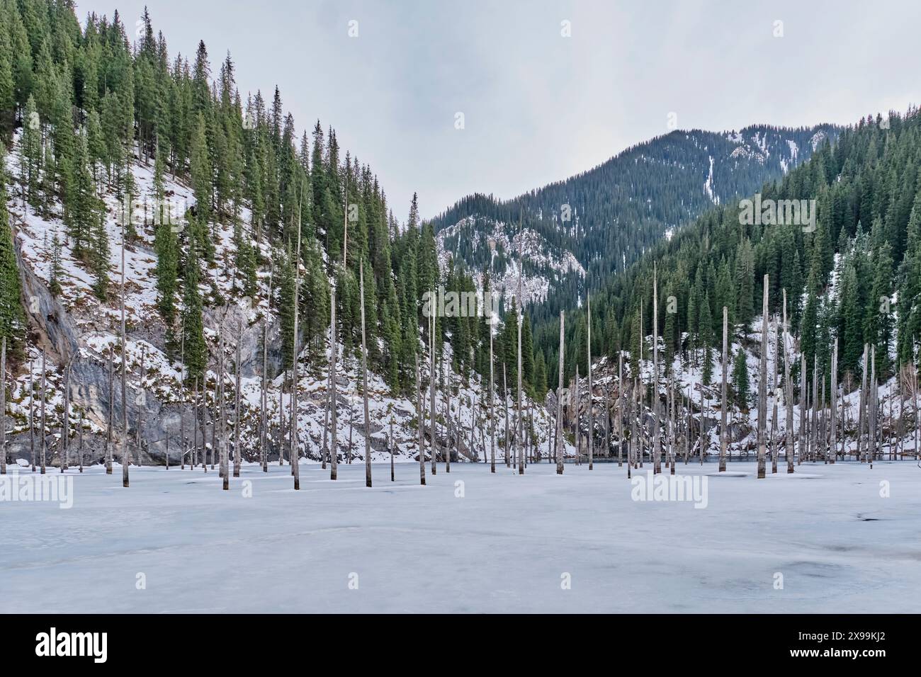 Lake Kaindy, covered with ice, natural location near Almaty, Kazakhstan ...