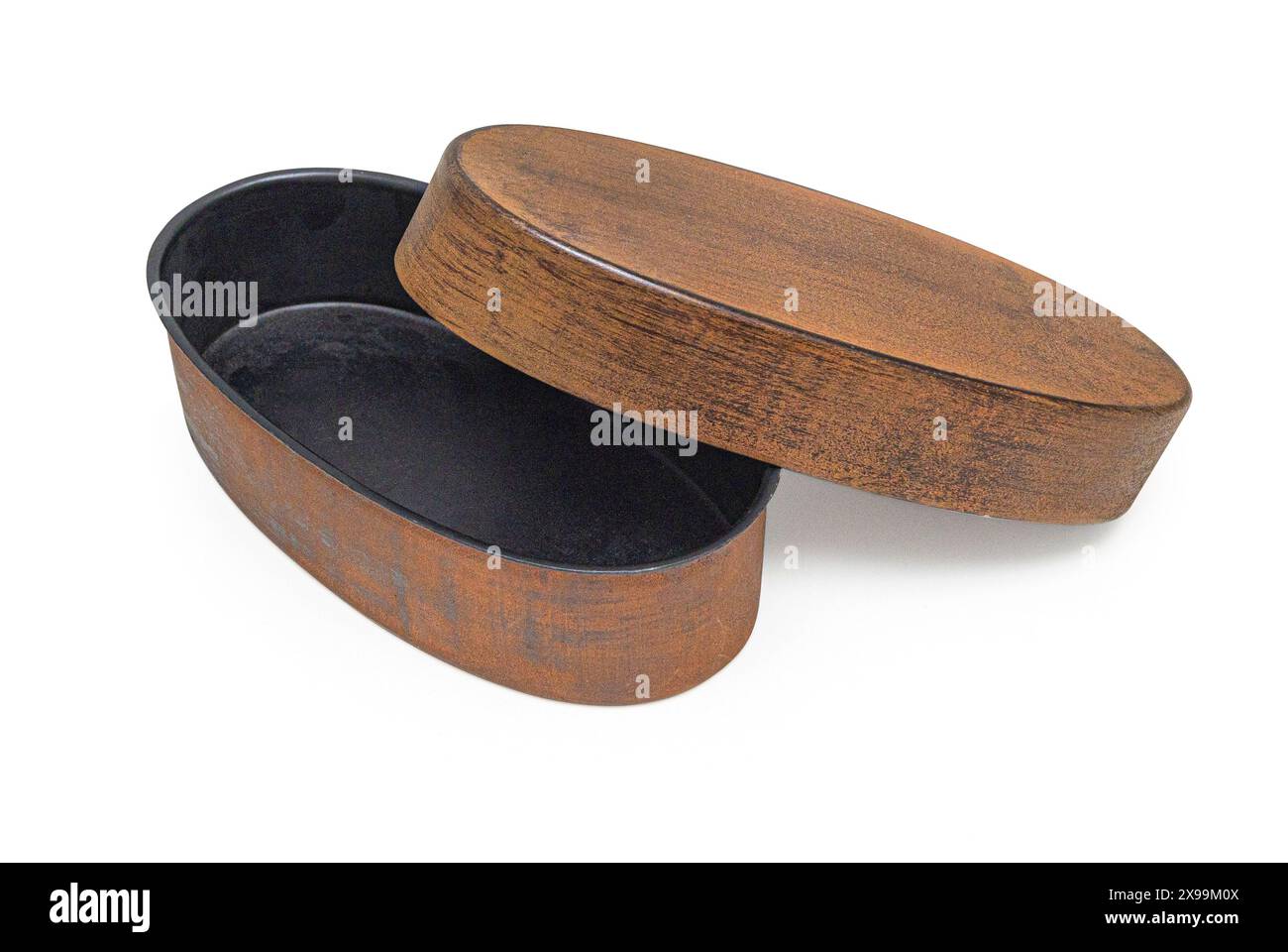 An old metal box on a white background. A dirty brass box. With ...