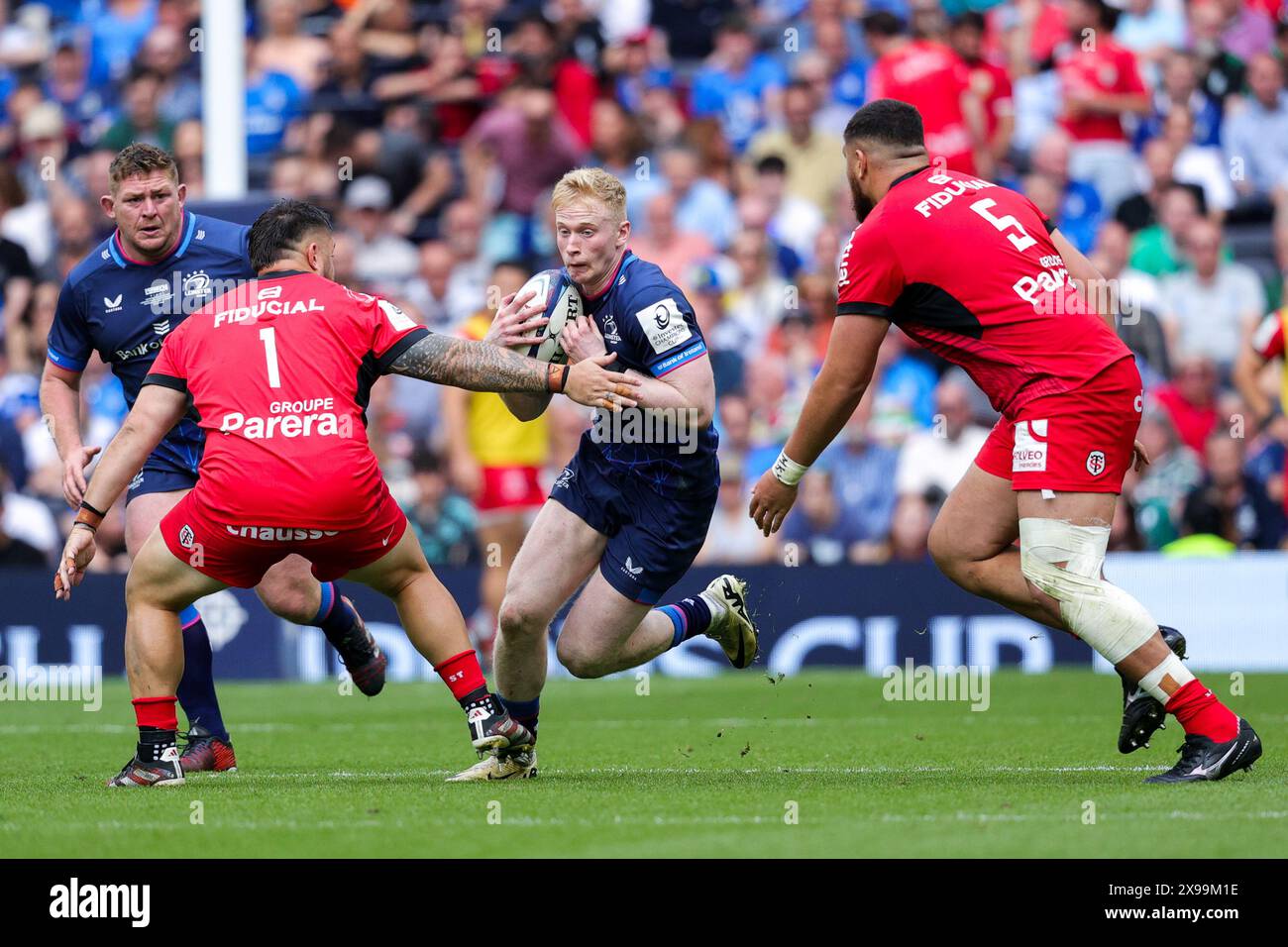 London, England. 25th May, 2024. Leinster's Jamie Osborne with Stade ...