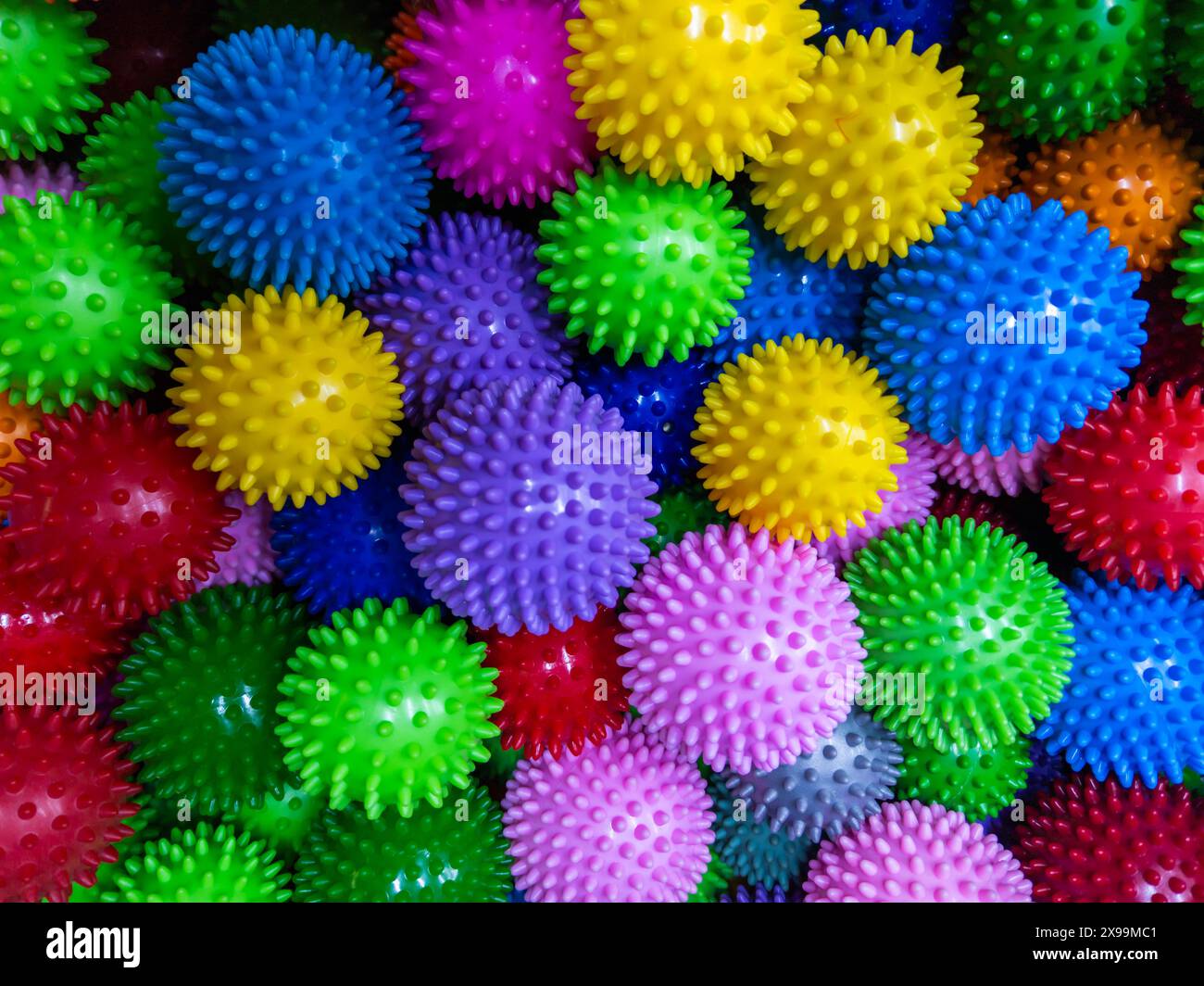 Closeup full-frame background of colorful spiked rubber balls Stock ...